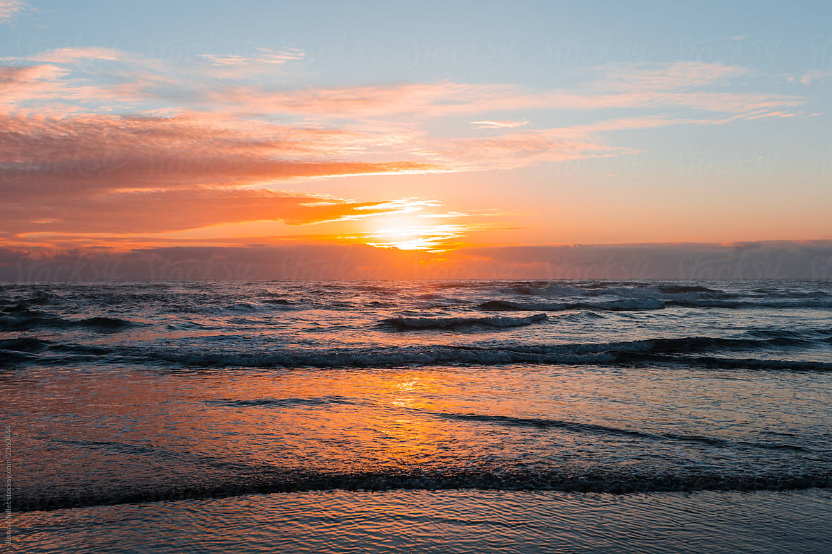 "Orange Pacific Sunset" by Stocksy Contributor "Justin Mullet" - Stocksy