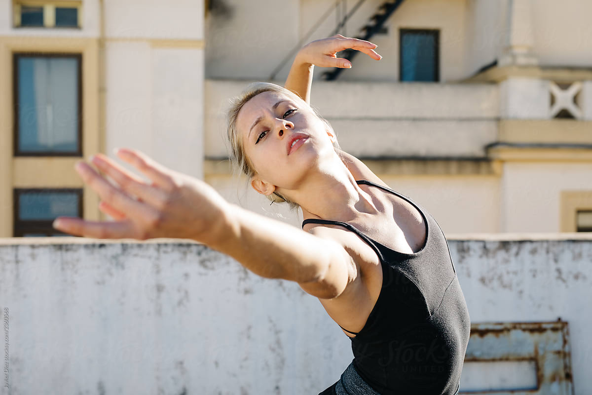 "Slim Woman Dancing On Terrace" by Stocksy Contributor "Javier Díez ...
