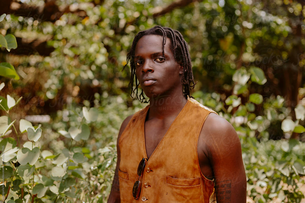 "Young Black Man Stood In Front Of Foliage" by Stocksy Contributor ...