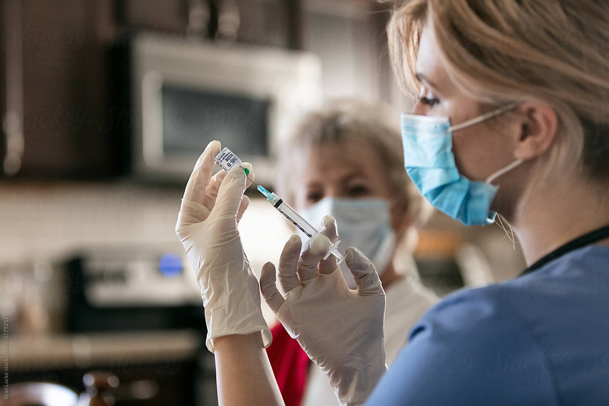"Health: Nurse Readies To Vaccinate Senior In Her Home" by Stocksy ...