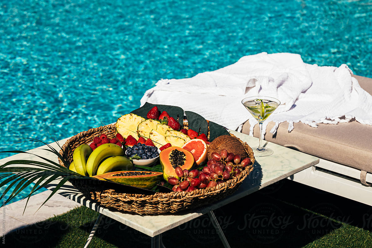 "Fresh Fruit Platter And Drink By The Pool" by Stocksy Contributor ...