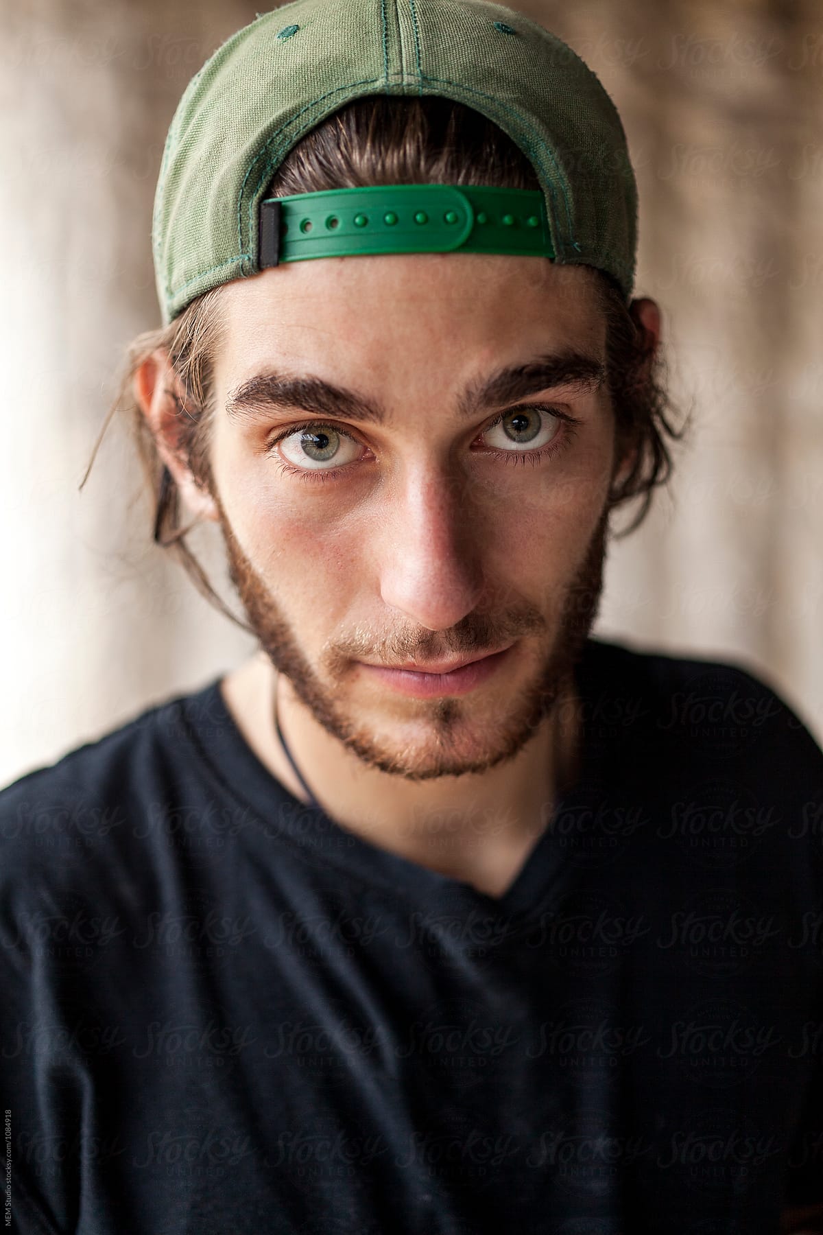 "Portrait Of A Young Man With A Green Hat" by Stocksy Contributor "MEM ...