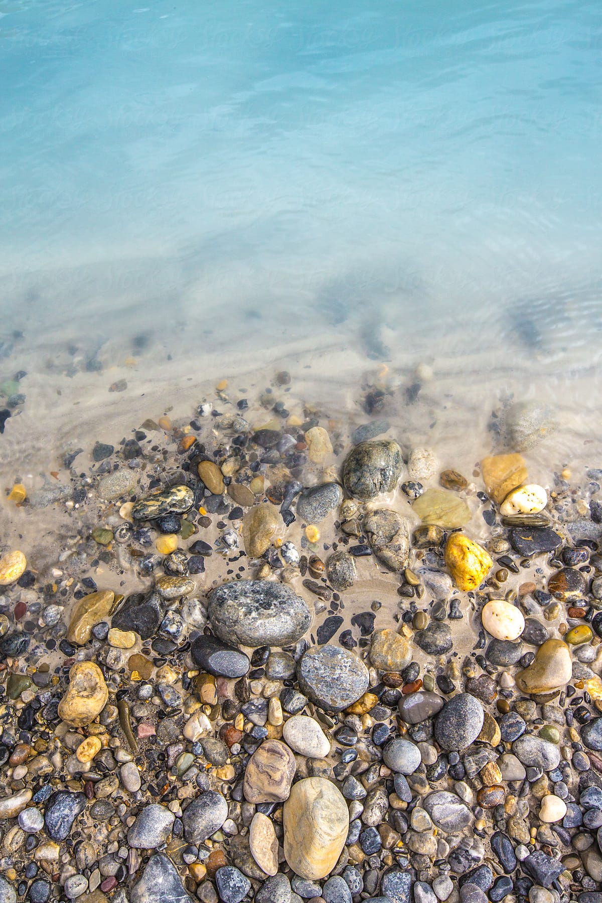"Pebbles On The Shore" by Stocksy Contributor "ALAN SHAPIRO" - Stocksy
