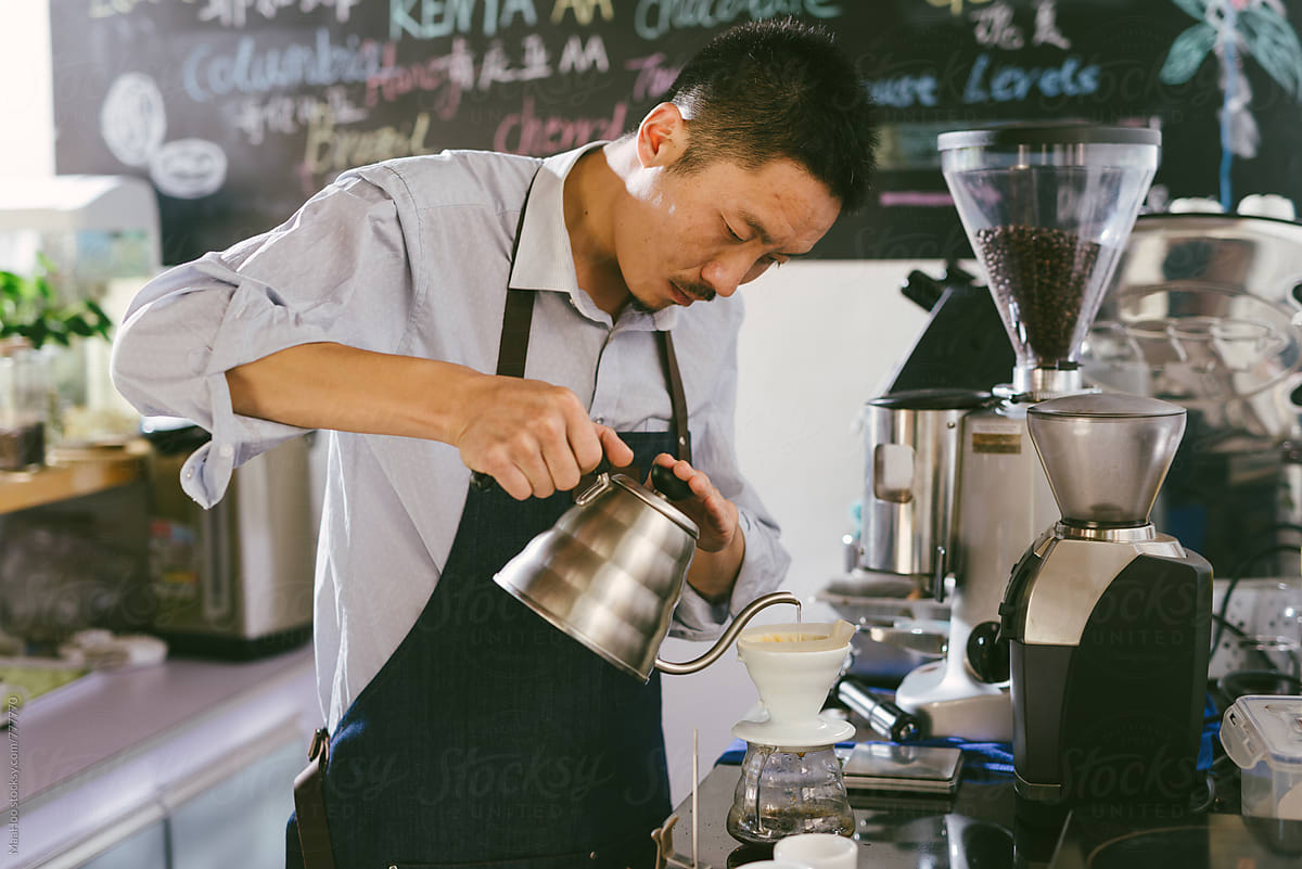 "Young Man Preparing Coffee" by Stocksy Contributor "MaaHoo" - Stocksy