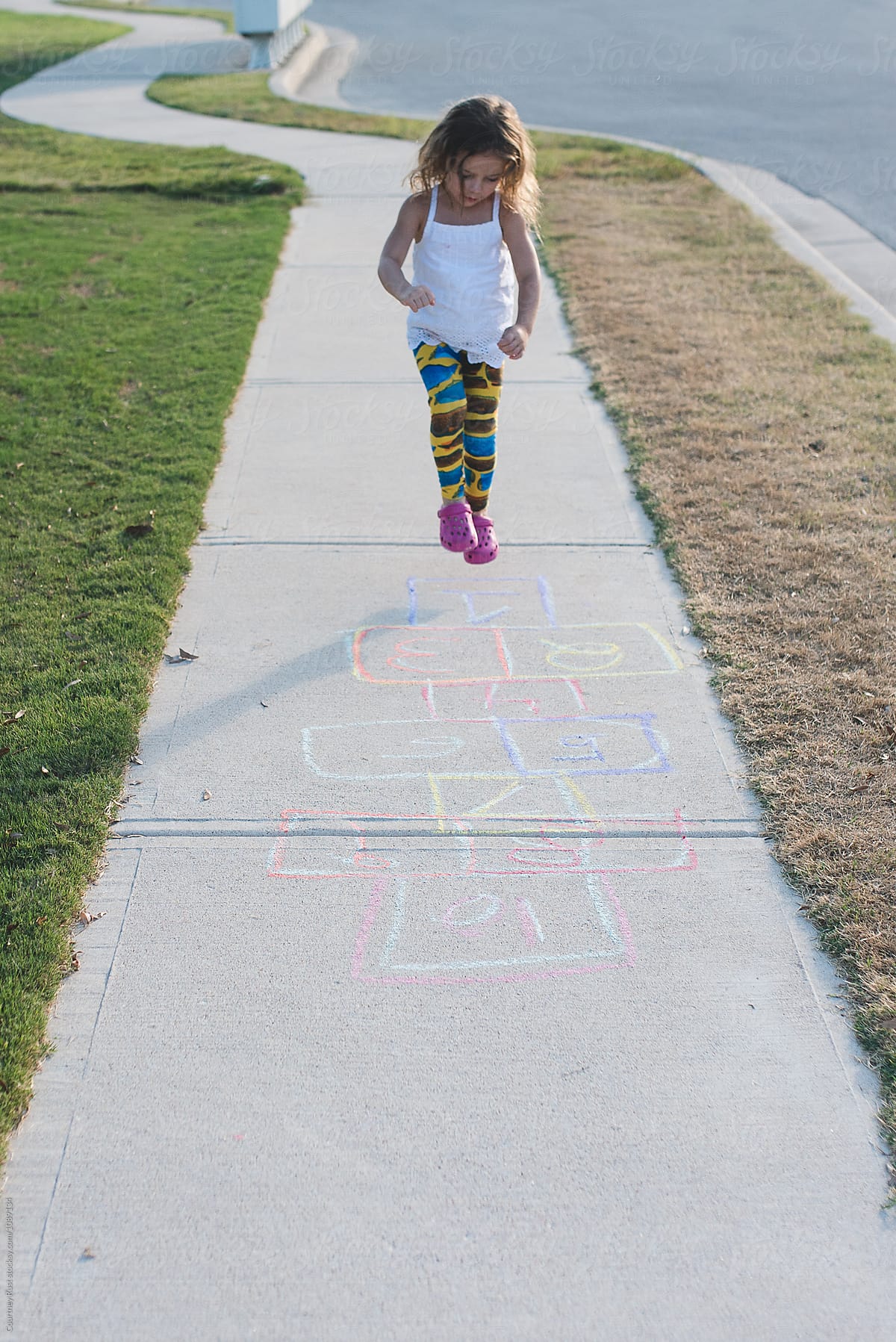 "Vertical Hopscotch" by Stocksy Contributor "Courtney Rust" - Stocksy