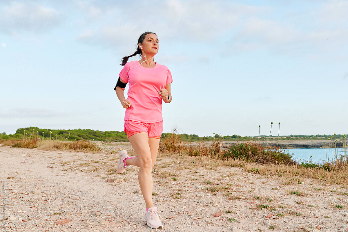 "Woman Running Alone Along On A Trail" by Stocksy Contributor "Ivan ...
