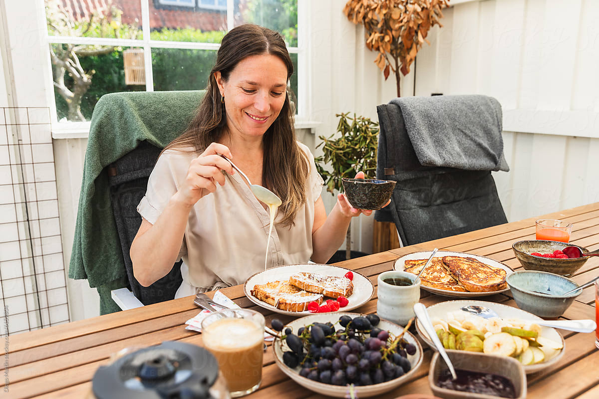 "Friends Enjoying Brunch On Home Terrace" by Stocksy Contributor "Diego ...