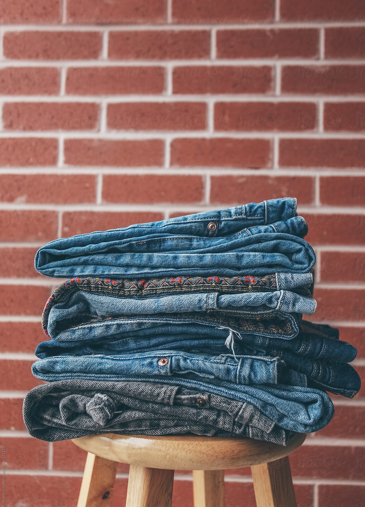 "Stack Of Denim Jeans" by Stocksy Contributor "Magida El-Kassis" - Stocksy