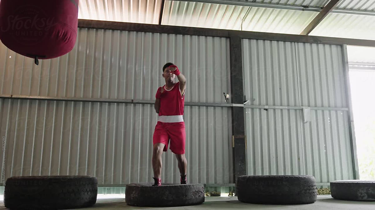 "Young Man Jumping Over Tyres" by Stocksy Contributor "Leonardo Borges ...