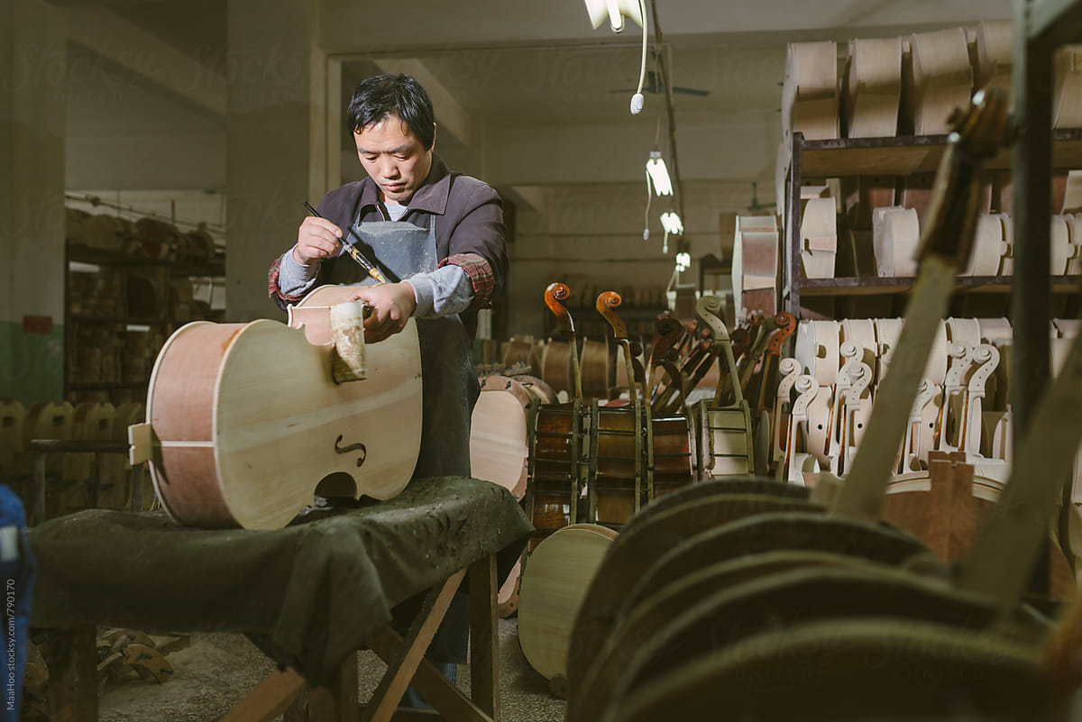 "Violin Maker At Work" by Stocksy Contributor "MaaHoo" - Stocksy