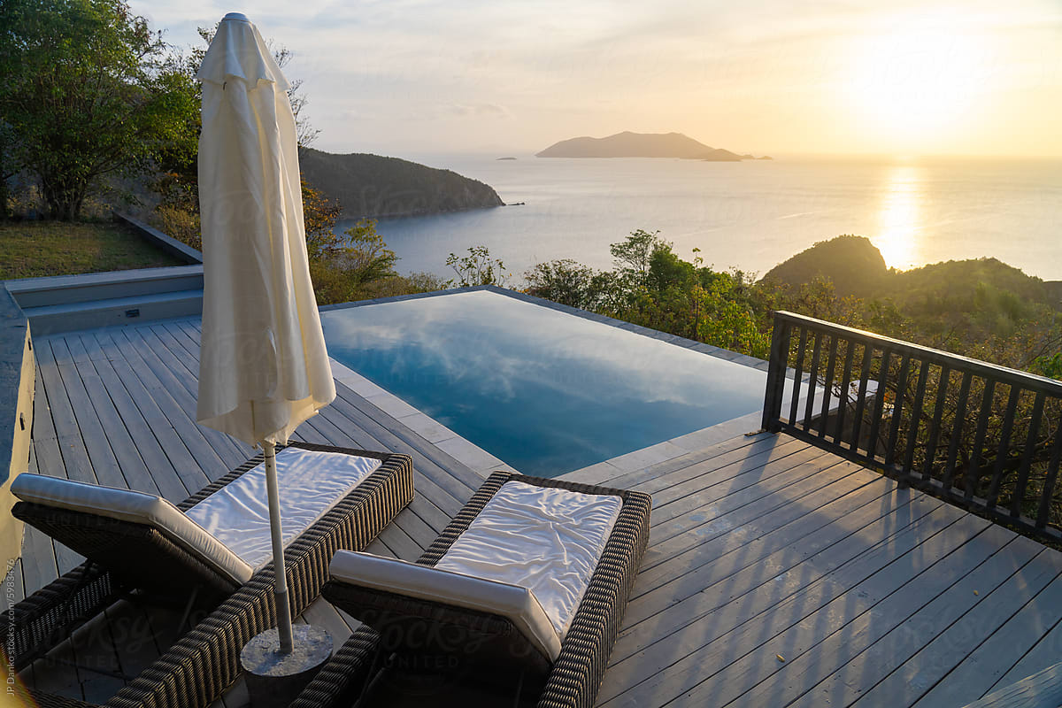 "Sunset At Luxury Caribbean Vacation Home Pool" by Stocksy Contributor ...