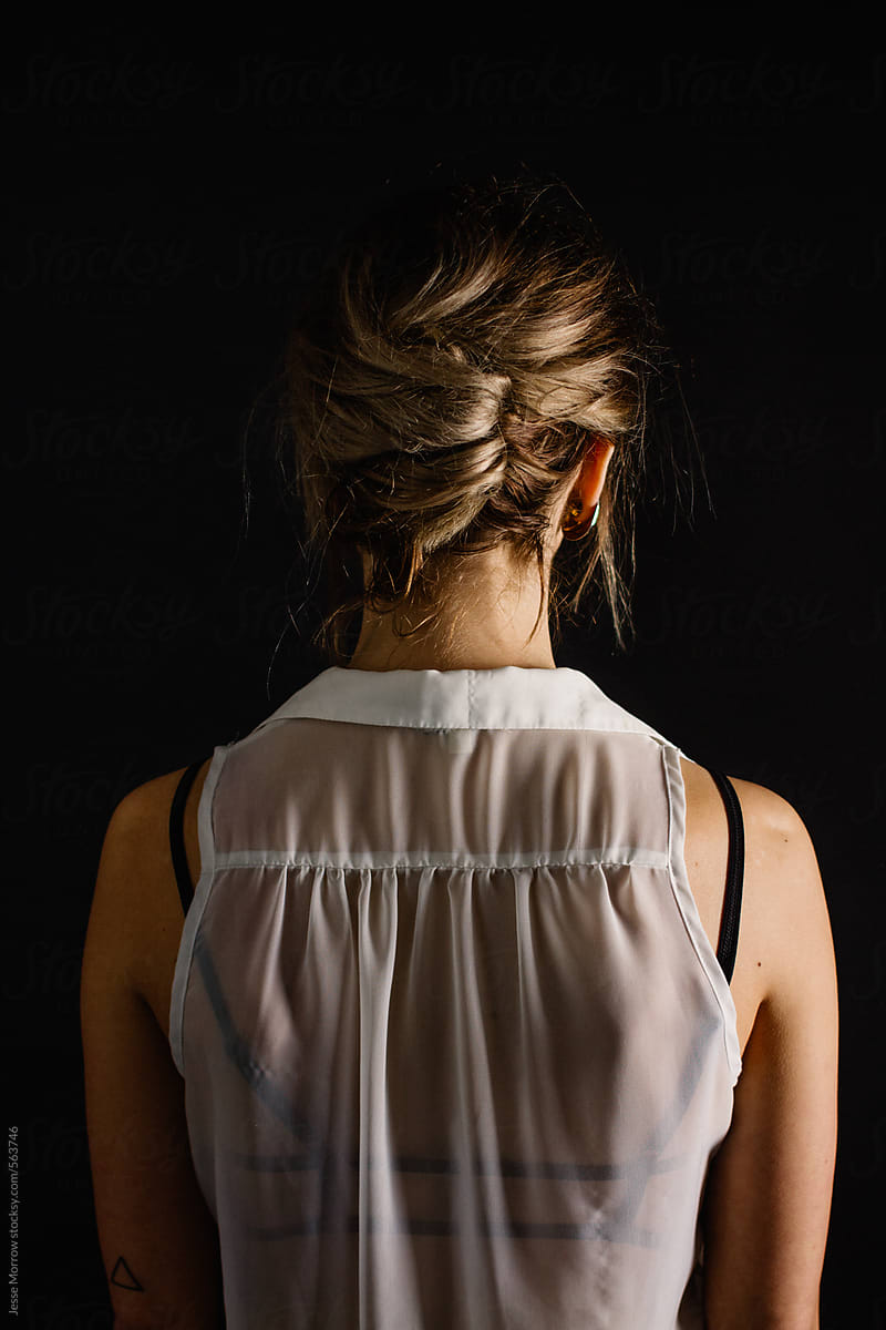 "Back Of Young Female In Dark Studio" by Stocksy Contributor "Jesse ...