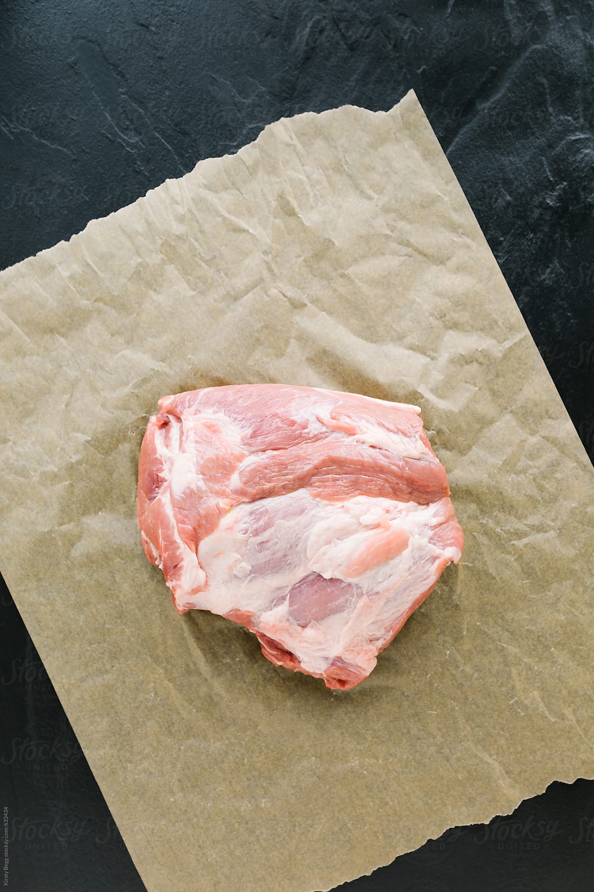 "Raw Pork Shoulder On Parchment Paper" by Stocksy Contributor "Kirsty ...