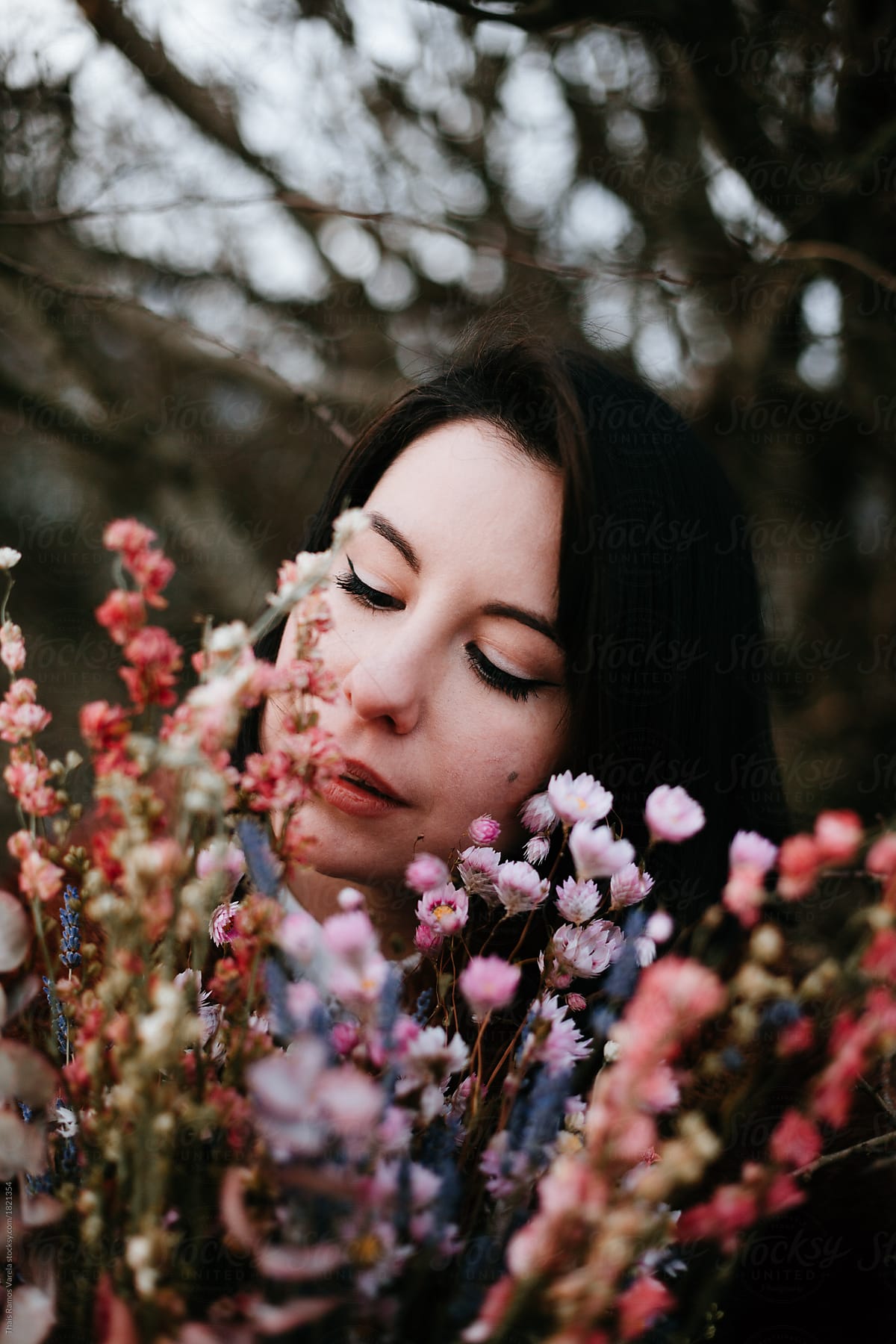 "Portrait Of A Beautiful Woman Smelling The Flowers" by Stocksy ...