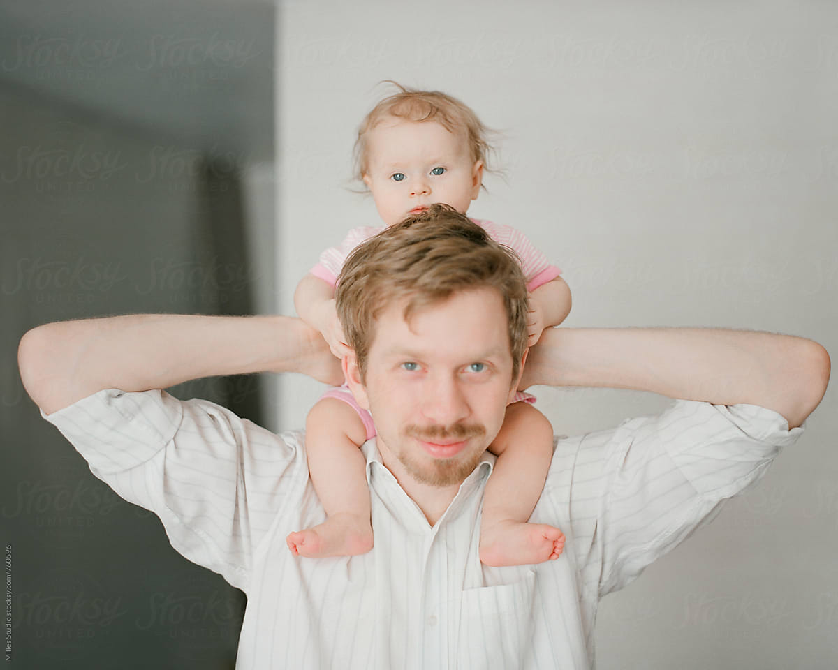 "Man Giving Piggyback To Baby" by Stocksy Contributor "Milles Team ...