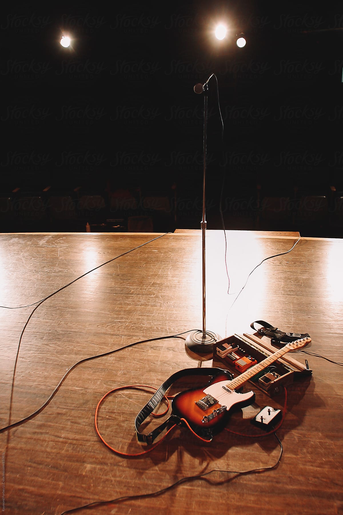 "Electric Guitar On Stage" by Stocksy Contributor "Raymond Forbes LLC ...