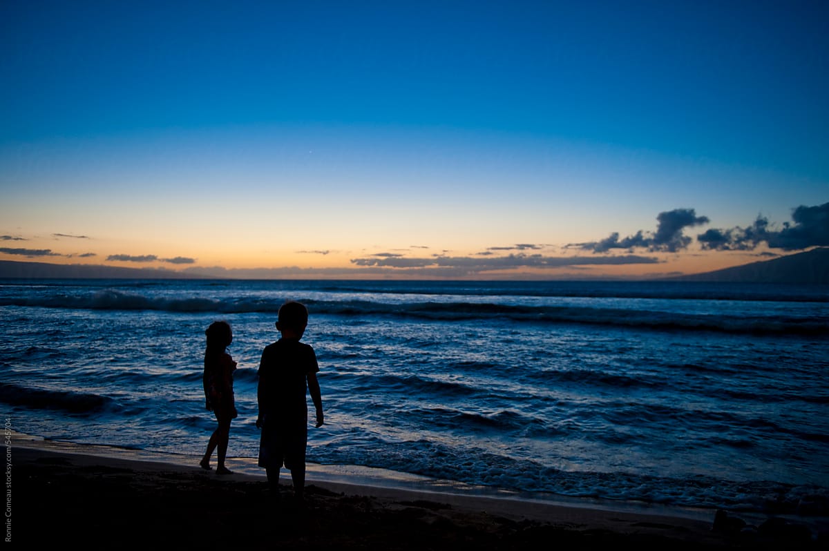 "Kids On Beach At Sunset" by Stocksy Contributor "Ronnie Comeau" - Stocksy
