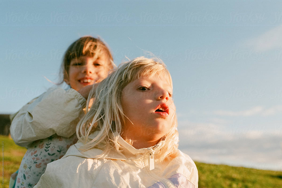 "Kids On The Grass" by Stocksy Contributor "Yatanni" - Stocksy