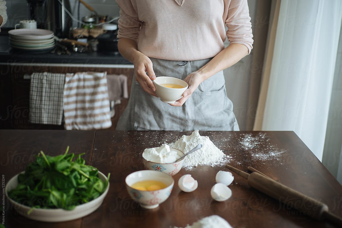"Woman Doing Kitchen Preparations" by Stocksy Contributor "Pietro ...