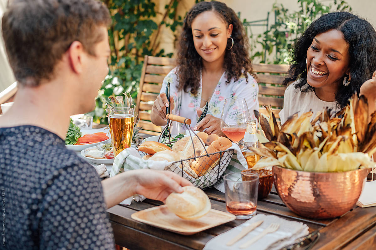 "Sharing Food Outside" by Stocksy Contributor "Jayme Burrows" - Stocksy