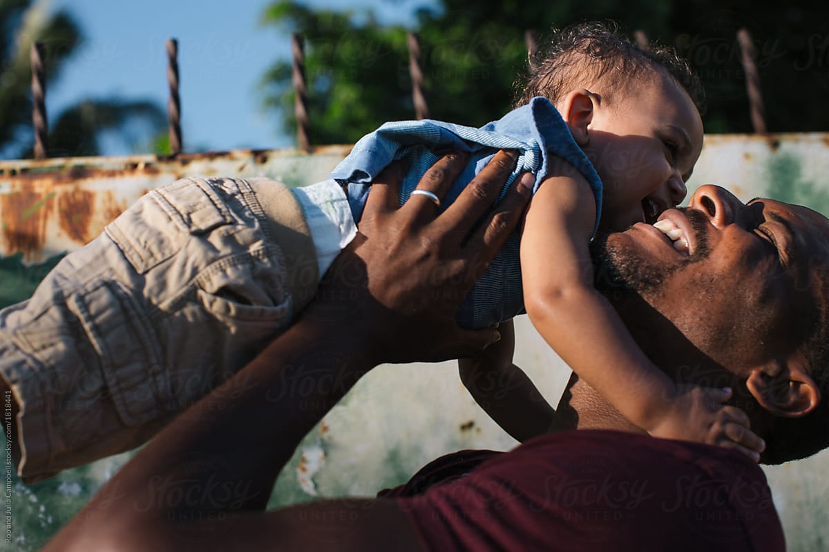 "Young Dad Enjoying Son Outside On Sunny Day" by Stocksy Contributor ...