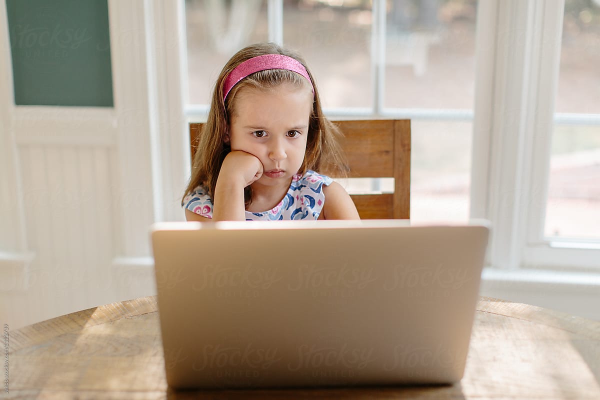 "Beautiful Young Girl Using A Computer At Home" by Stocksy Contributor ...