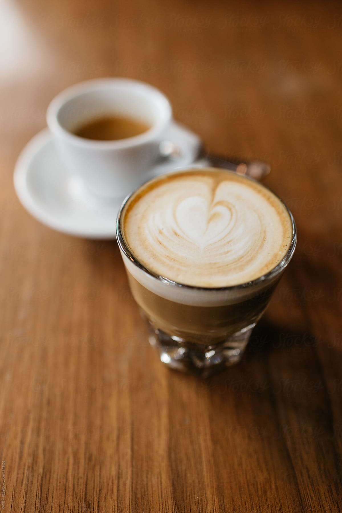 "Two Coffees Sitting On A Table, An Espresso And A Macchiato" by ...