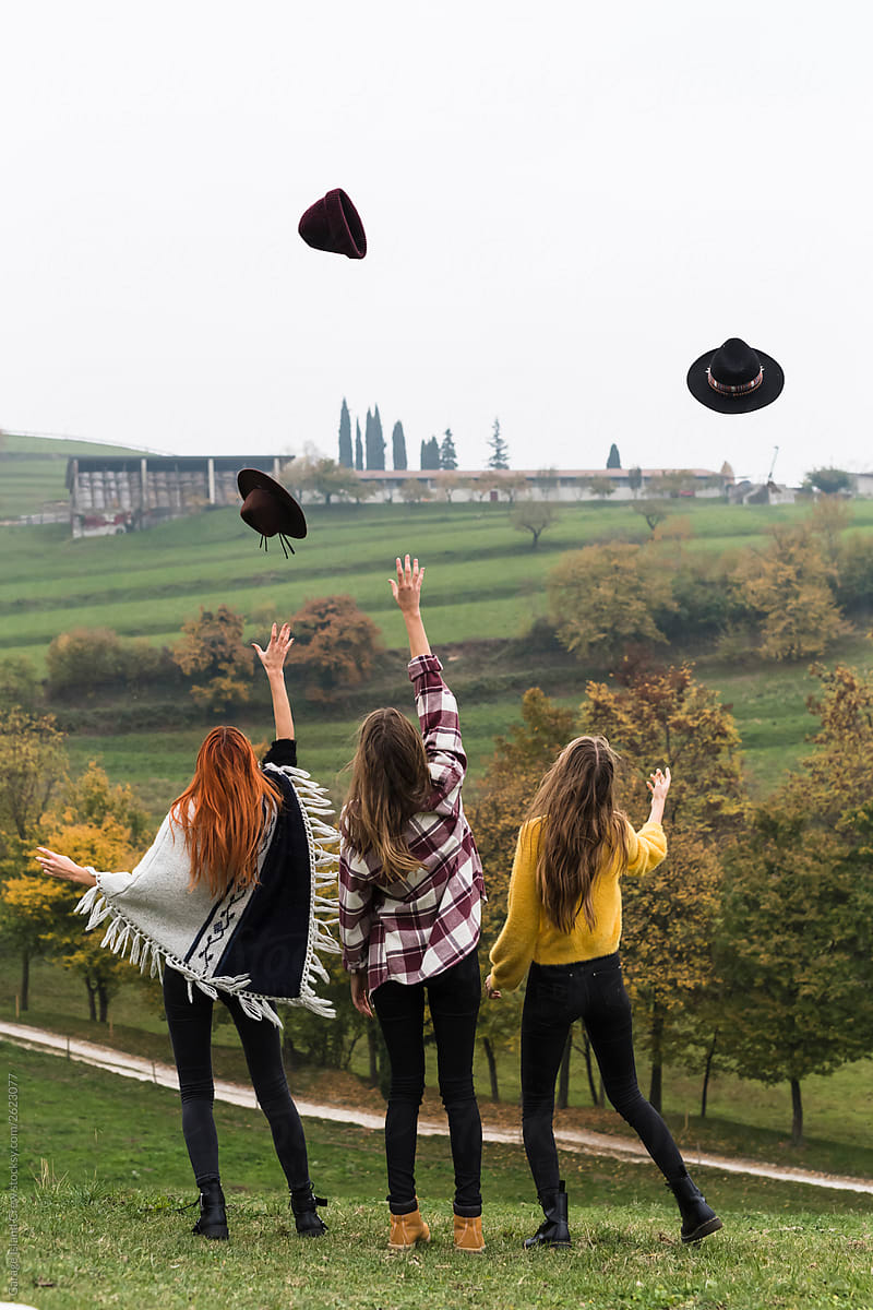 "Three Young Women Throwing Their Hats Away" by Stocksy Contributor ...