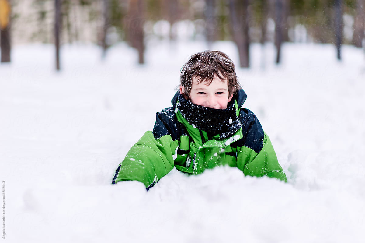 "Smiling Boy Playing In Snow" by Stocksy Contributor "Angela Lumsden ...