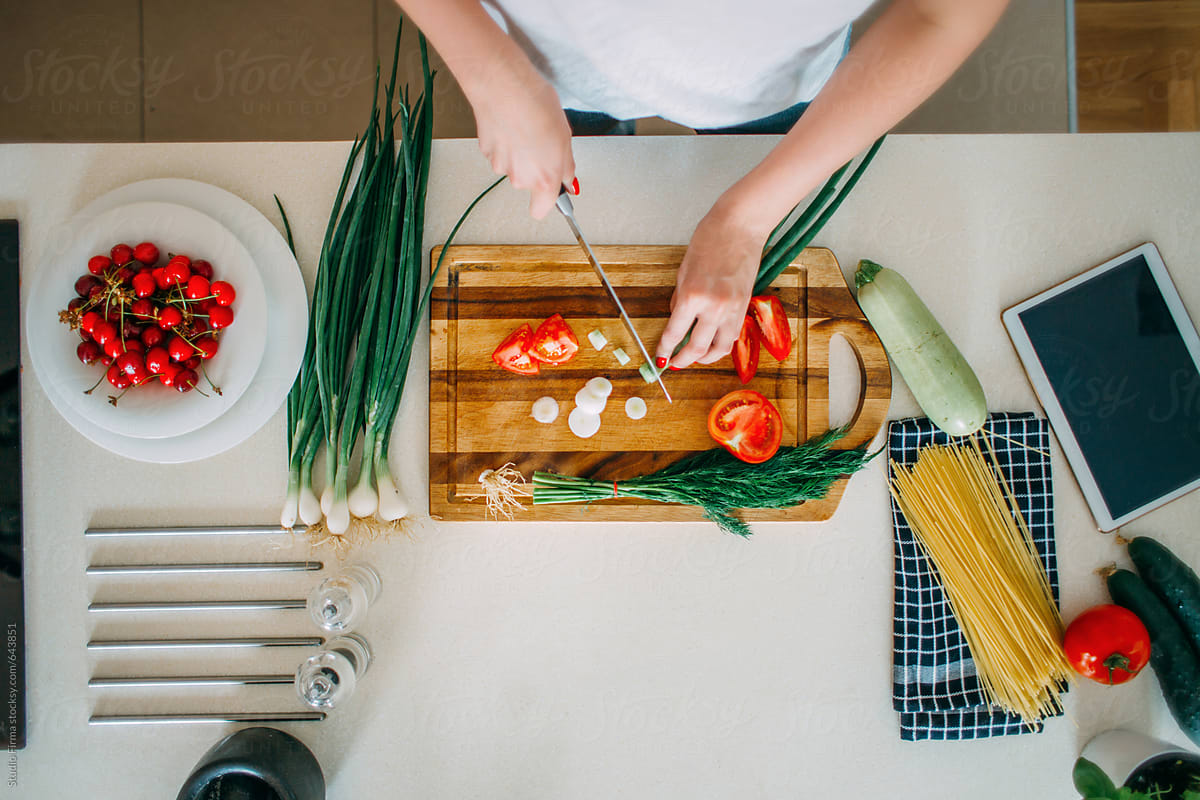 "Woman Cutting Vegetables In The Kitchen." by Stocksy Contributor ...