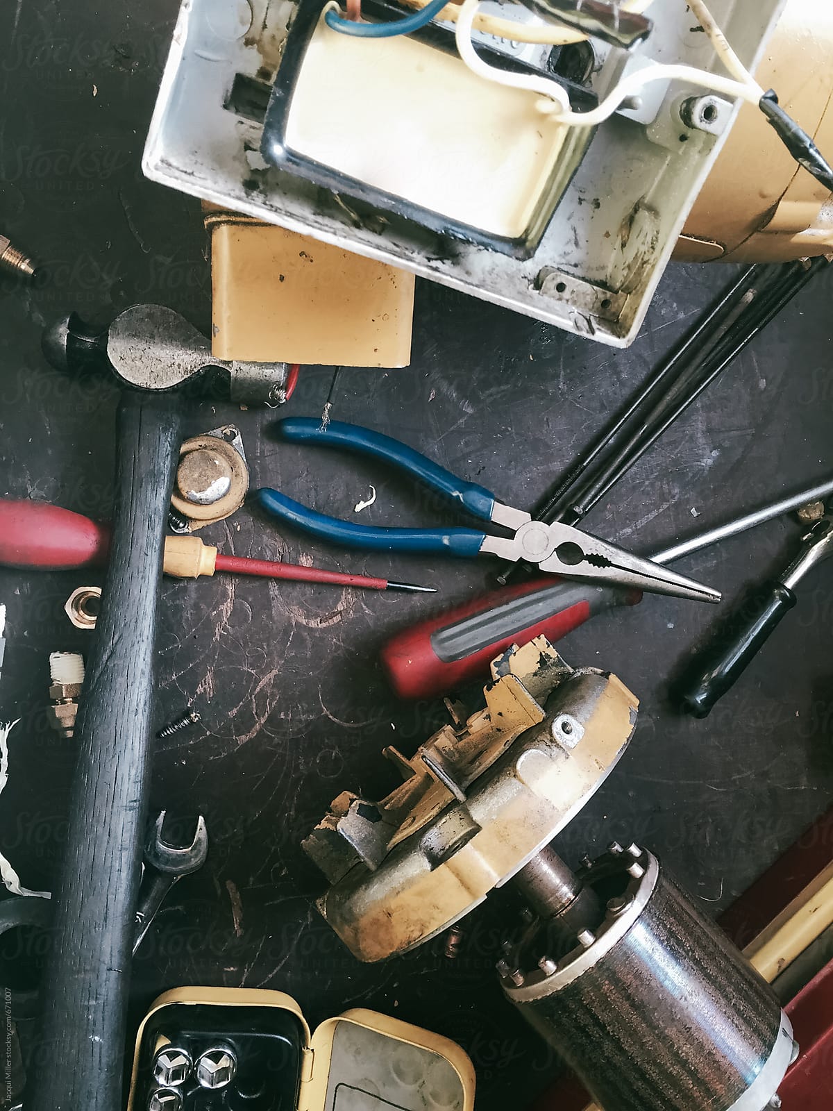 "Electricians Messy Desk With Dismantled Motor" by Stocksy Contributor ...