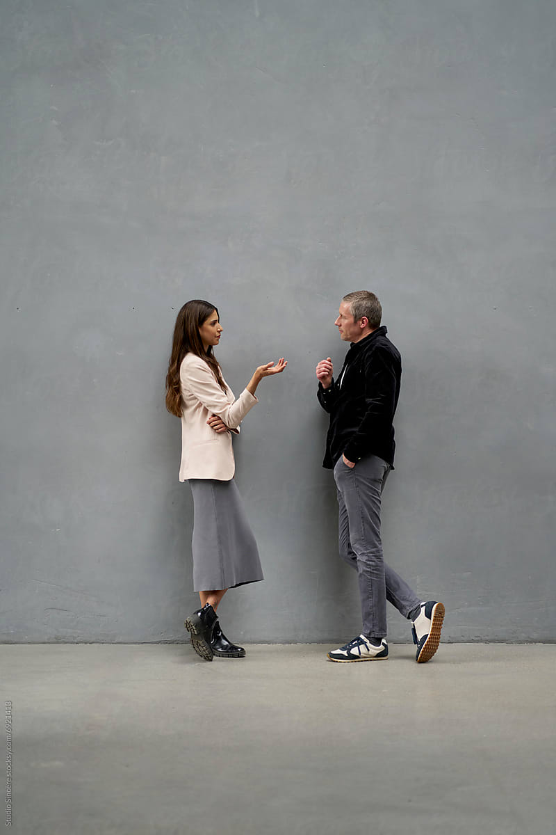 "Two People Converse In A Modern Setting" by Stocksy Contributor ...