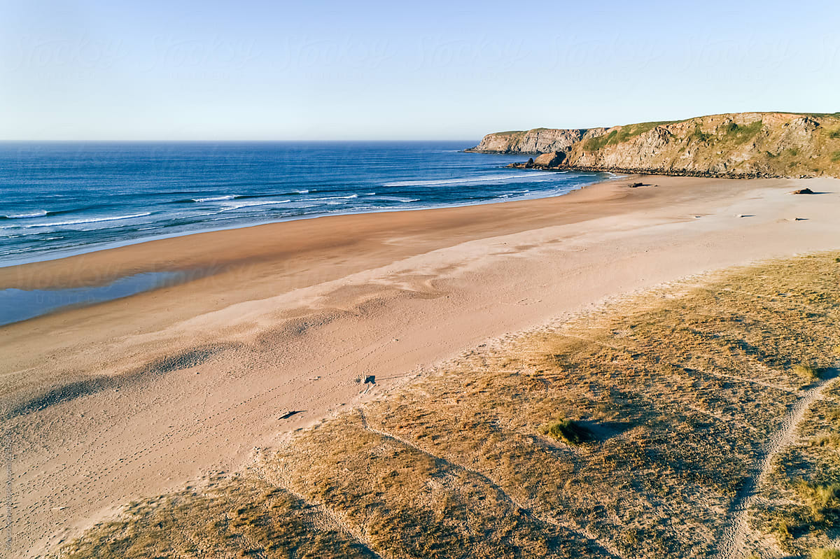 "Aerial View Of A Wild Beach At Sunset" by Stocksy Contributor "Marco ...