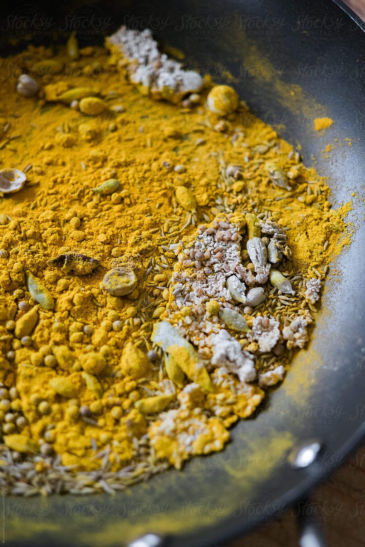 "Dry Roasting Indian Spices" by Stocksy Contributor "Rowena Naylor ...