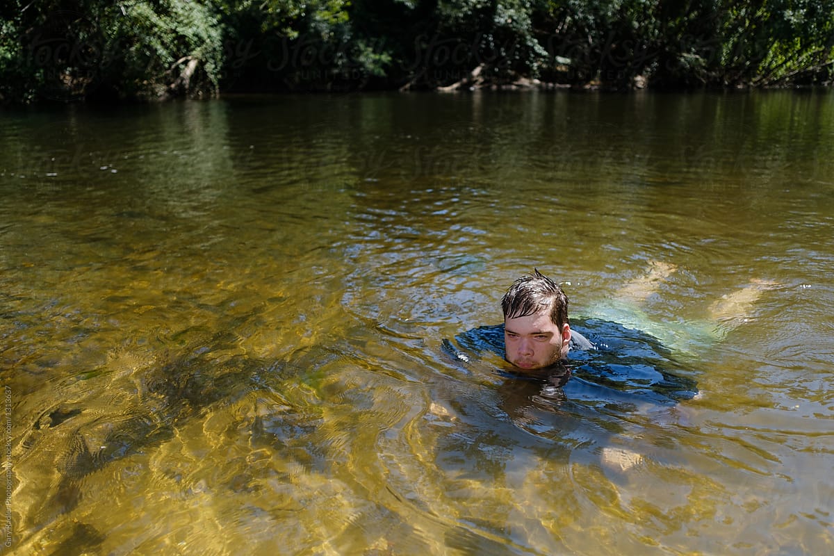 "Man Relaxing In River" by Stocksy Contributor "Gary Radler Photography ...