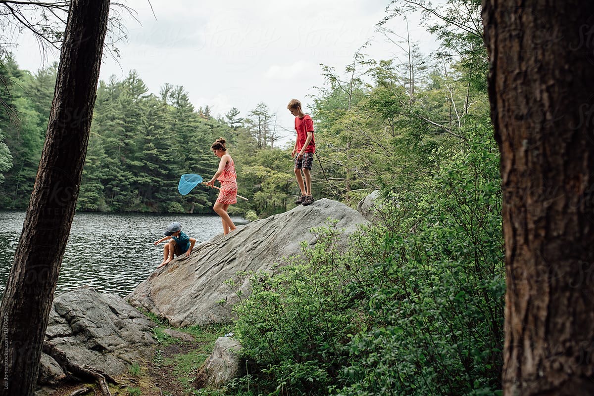 "Three Kids On A Rock By A Lake" by Stocksy Contributor "Lea Jones ...