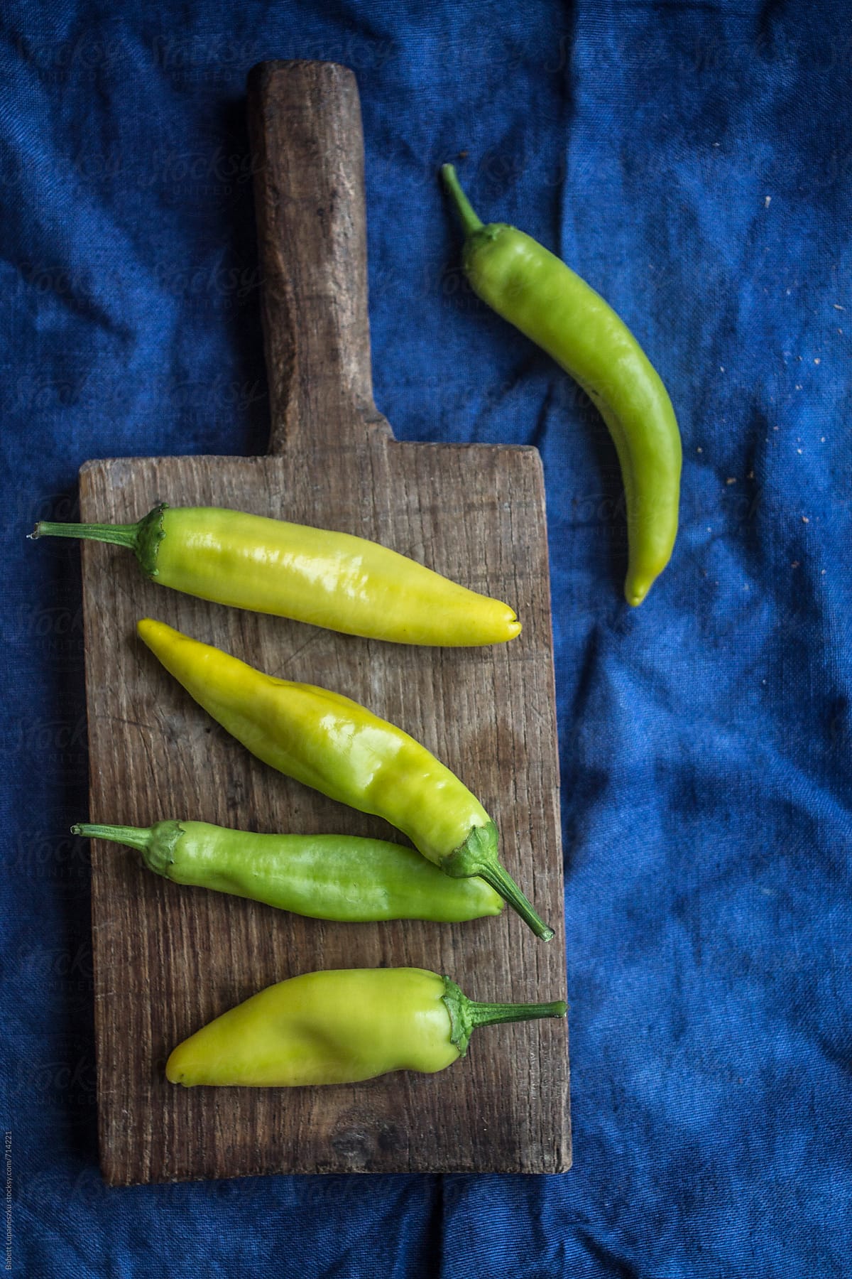 "Hot Peppers On Cutting Board" by Stocksy Contributor "Babett ...
