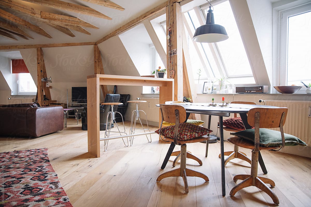 "Dining Area In A Loft" by Stocksy Contributor "Lilly Bloom" - Stocksy