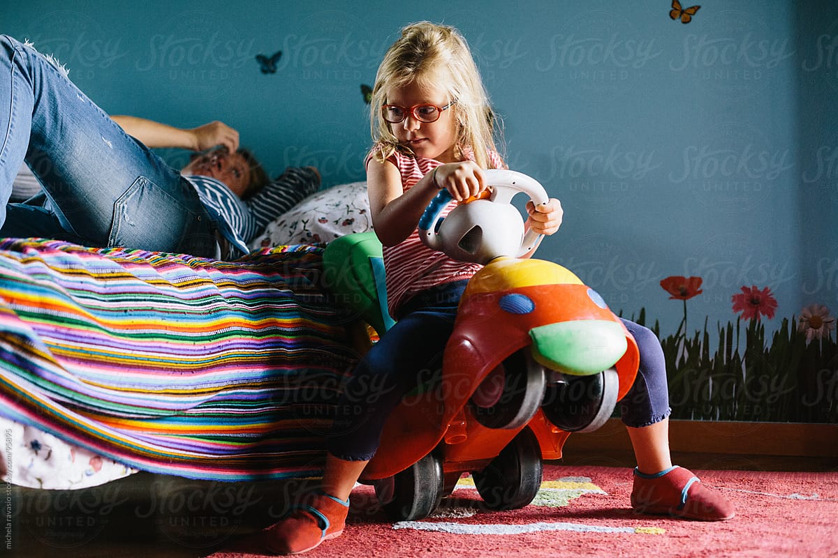 "Little Girl Playing With A Toy Car, At Home." by Stocksy Contributor ...