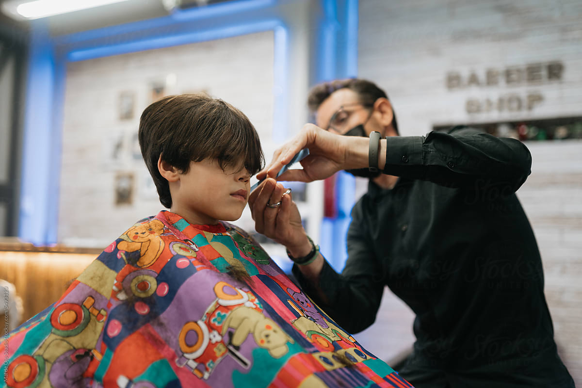 "Barber Confidently Cuts Child's Hair" by Stocksy Contributor "Mal De ...