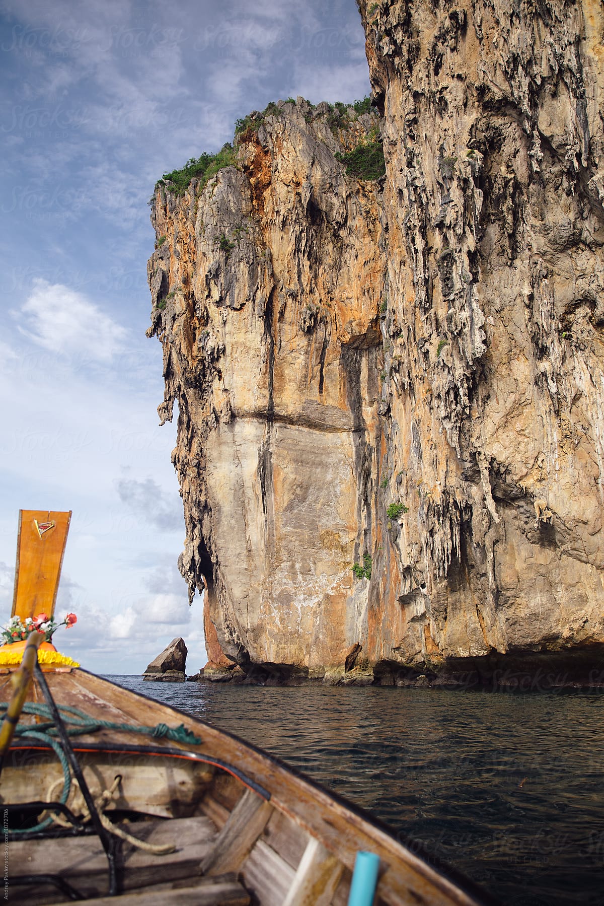 "Boat In Cave On Water" by Stocksy Contributor "Andrey Pavlov" - Stocksy