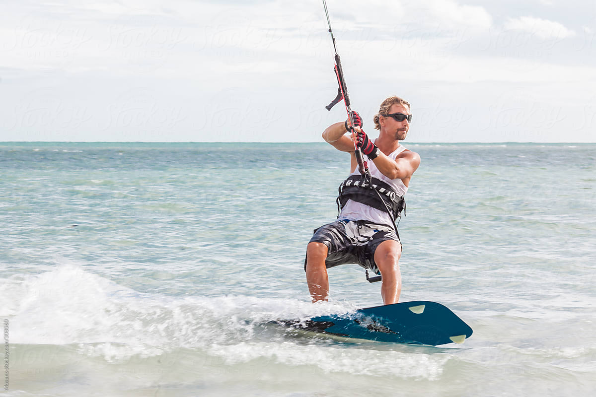 "Male Kite Surfer" by Stocksy Contributor "Mosuno" - Stocksy