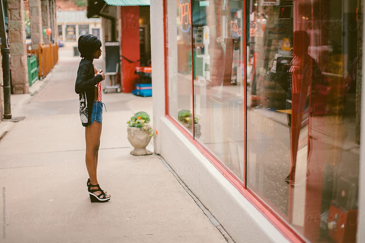 "Black Girl Looking At Her Reflection At An Arcade" by Stocksy ...