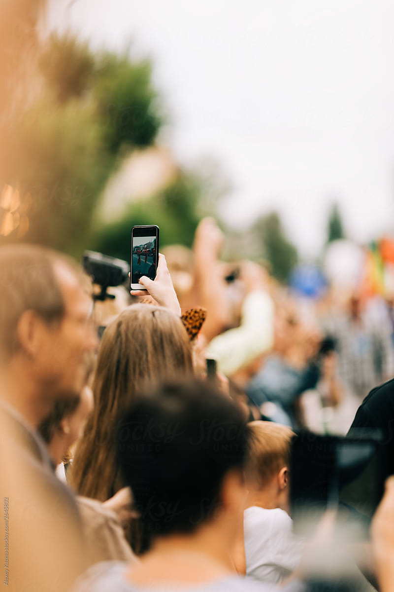 "Crowd With Cell Phones" by Stocksy Contributor "Alexey Kuzma" - Stocksy