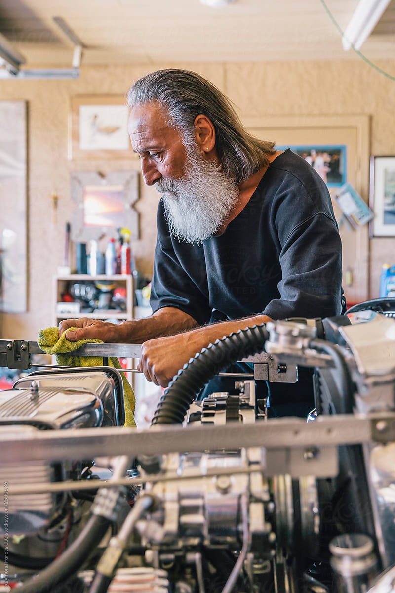 "Auto Mechanic Working On His Car In His Garage" by Stocksy Contributor ...