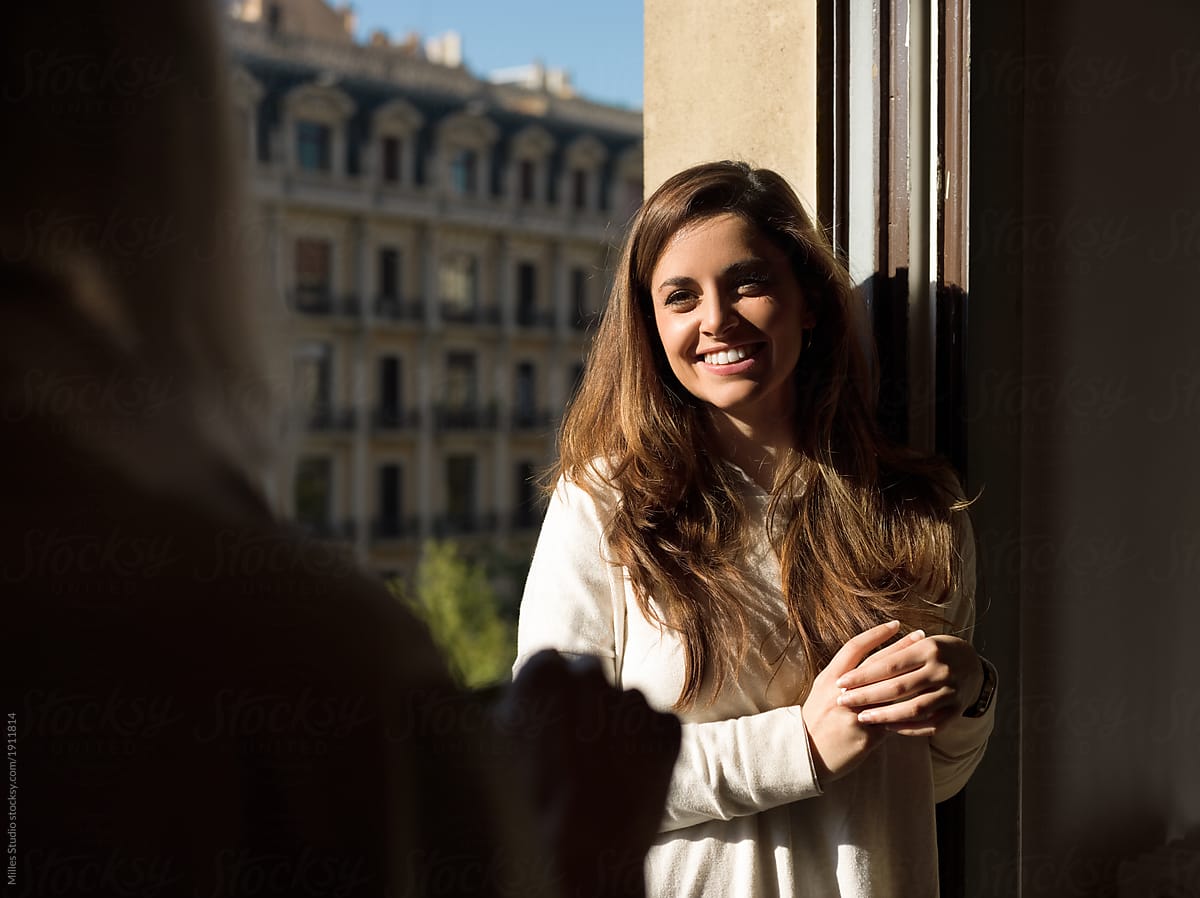 "Cheerful Girl In Doorway Having Talk" by Stocksy Contributor "Milles ...