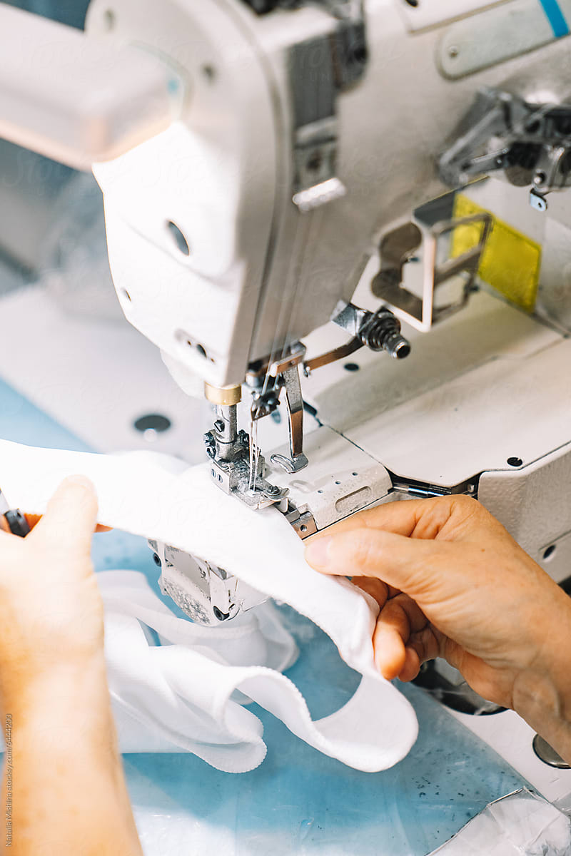 "Sewing Machine In Action For Fabric Creation In Workshop" by Stocksy ...