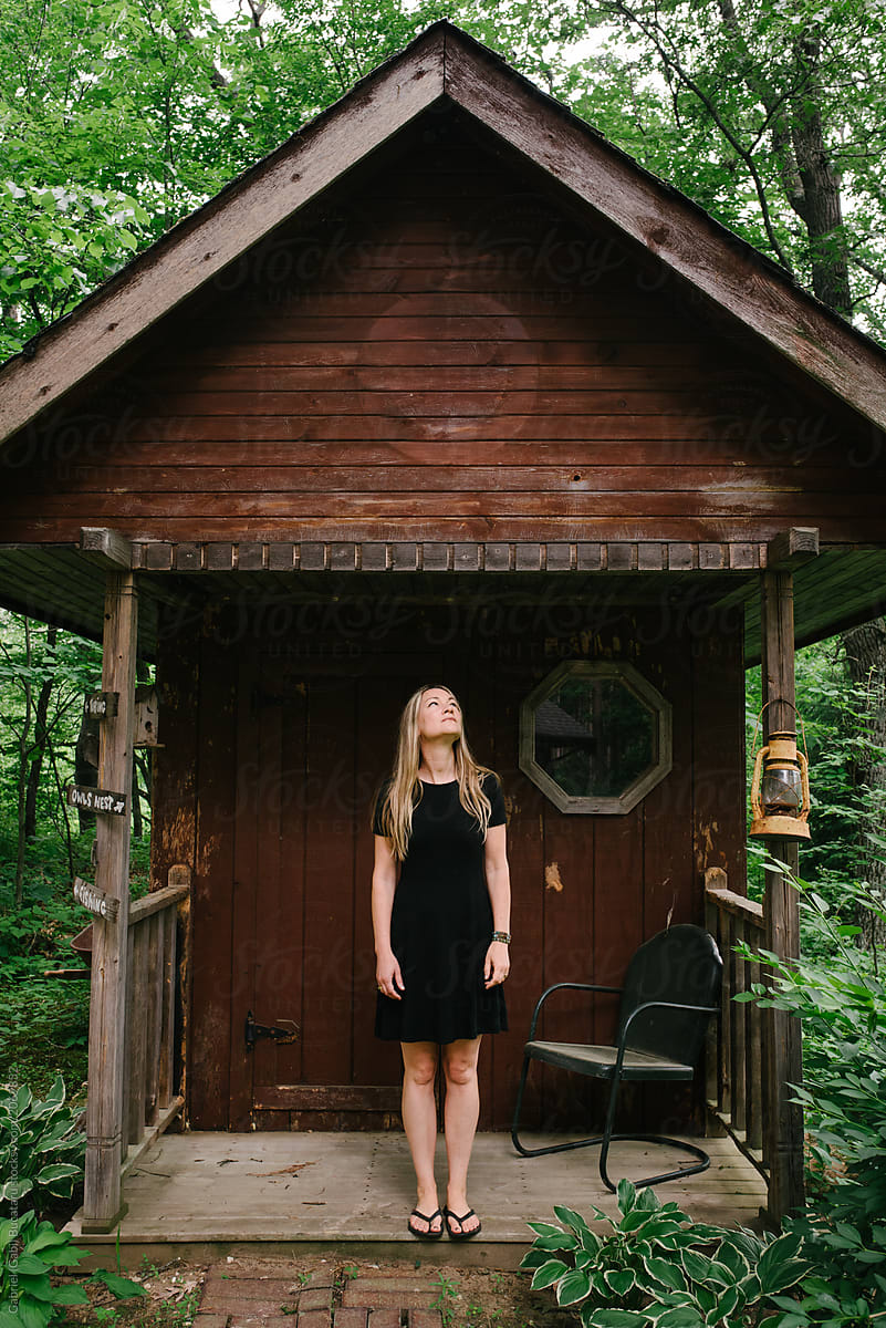 "Woman Standing By A Shack" by Stocksy Contributor "Gabi Bucataru ...
