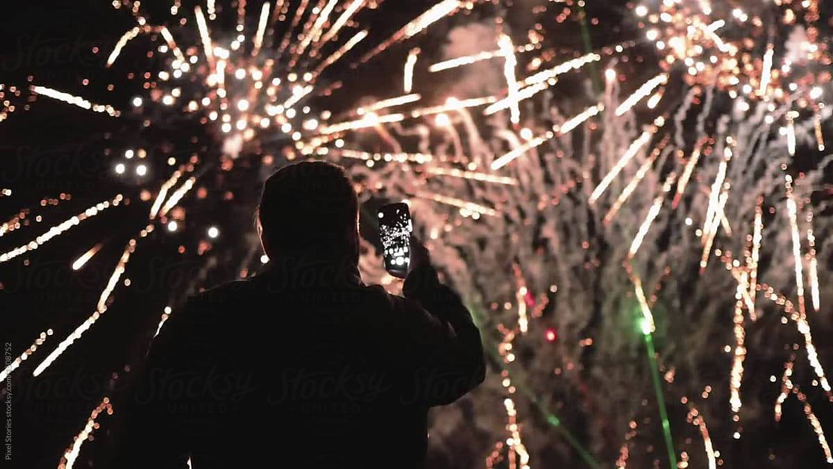 "Young Man Watching Fireworks Culmination" by Stocksy Contributor ...