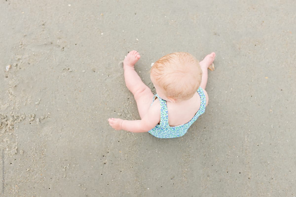 "Baby Playing At The Ocean" by Stocksy Contributor "Meaghan Curry ...